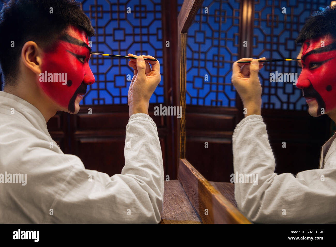 Male Peking Opera actor backstage makeup Stock Photo - Alamy