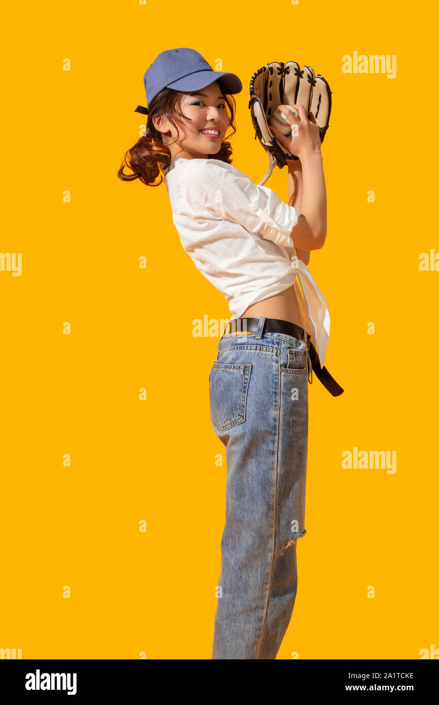 Young girls play baseball Stock Photo - Alamy