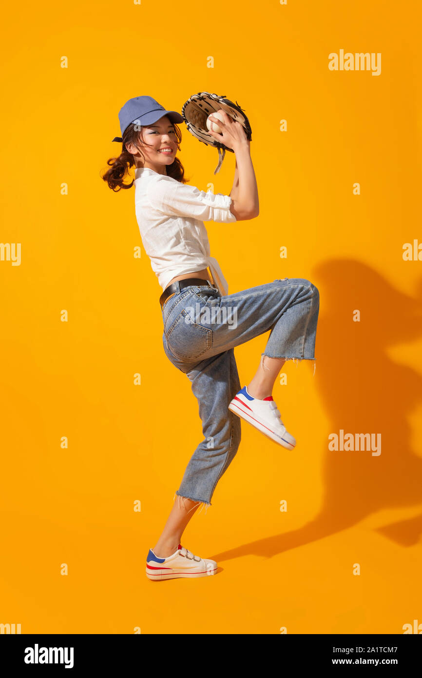 Young girls play baseball Stock Photo - Alamy