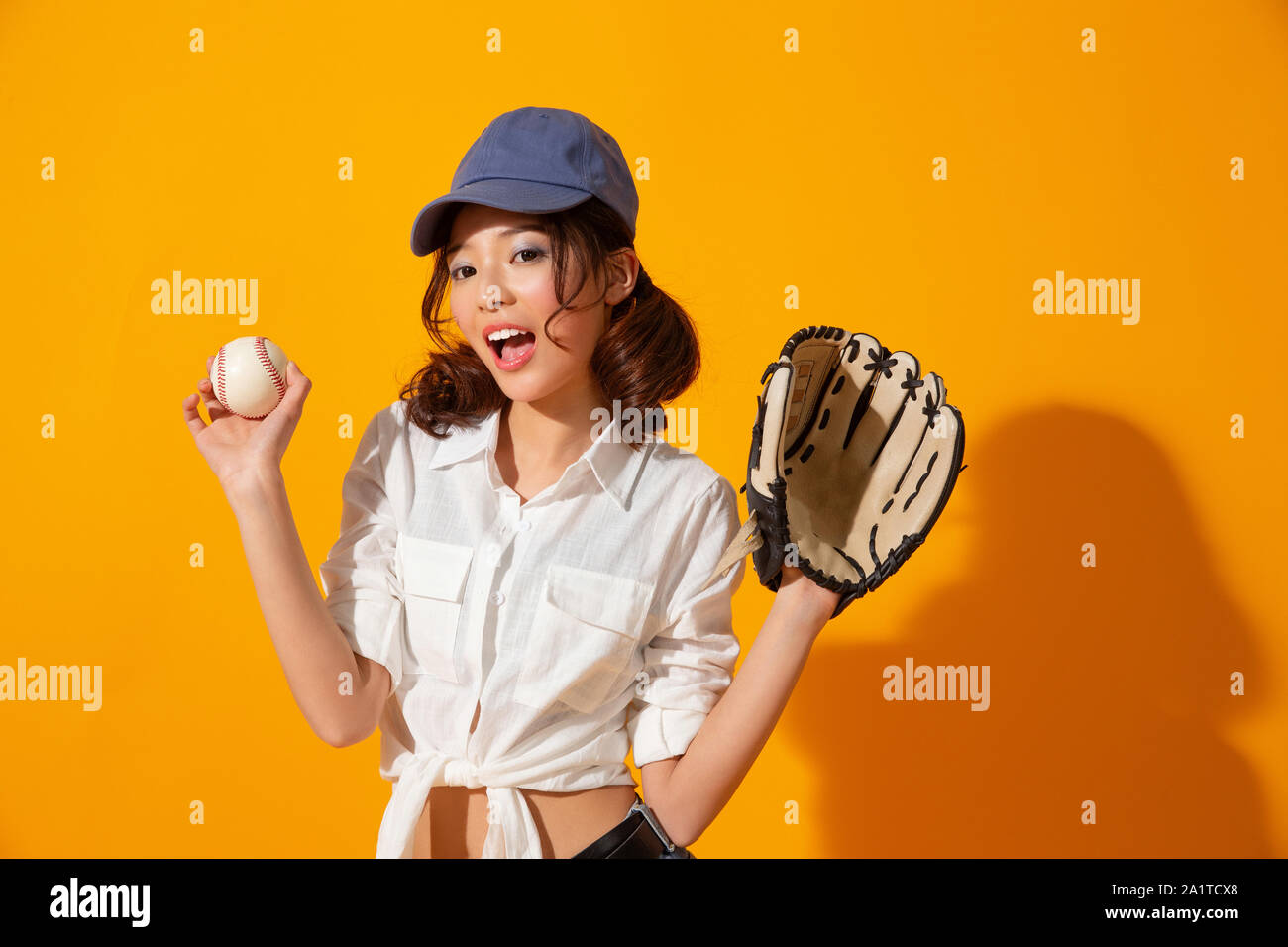Young girls play baseball Stock Photo - Alamy