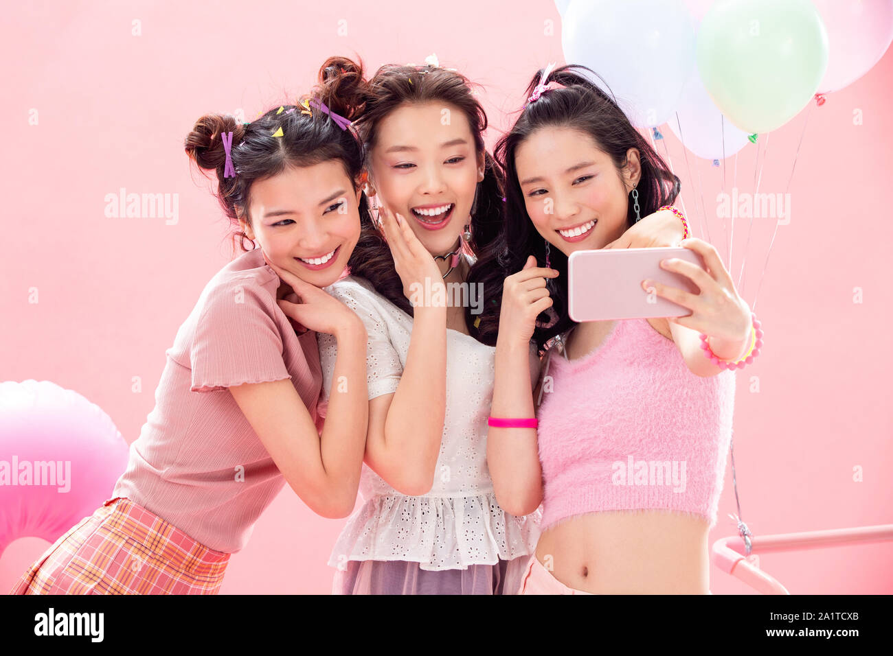 Happy girl with mobile phones Stock Photo - Alamy