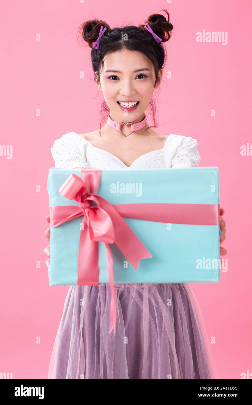 Happy girl with a gift Stock Photo - Alamy