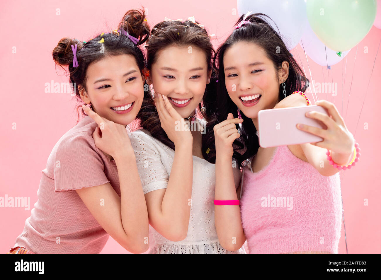 Happy girl with mobile phones Stock Photo - Alamy
