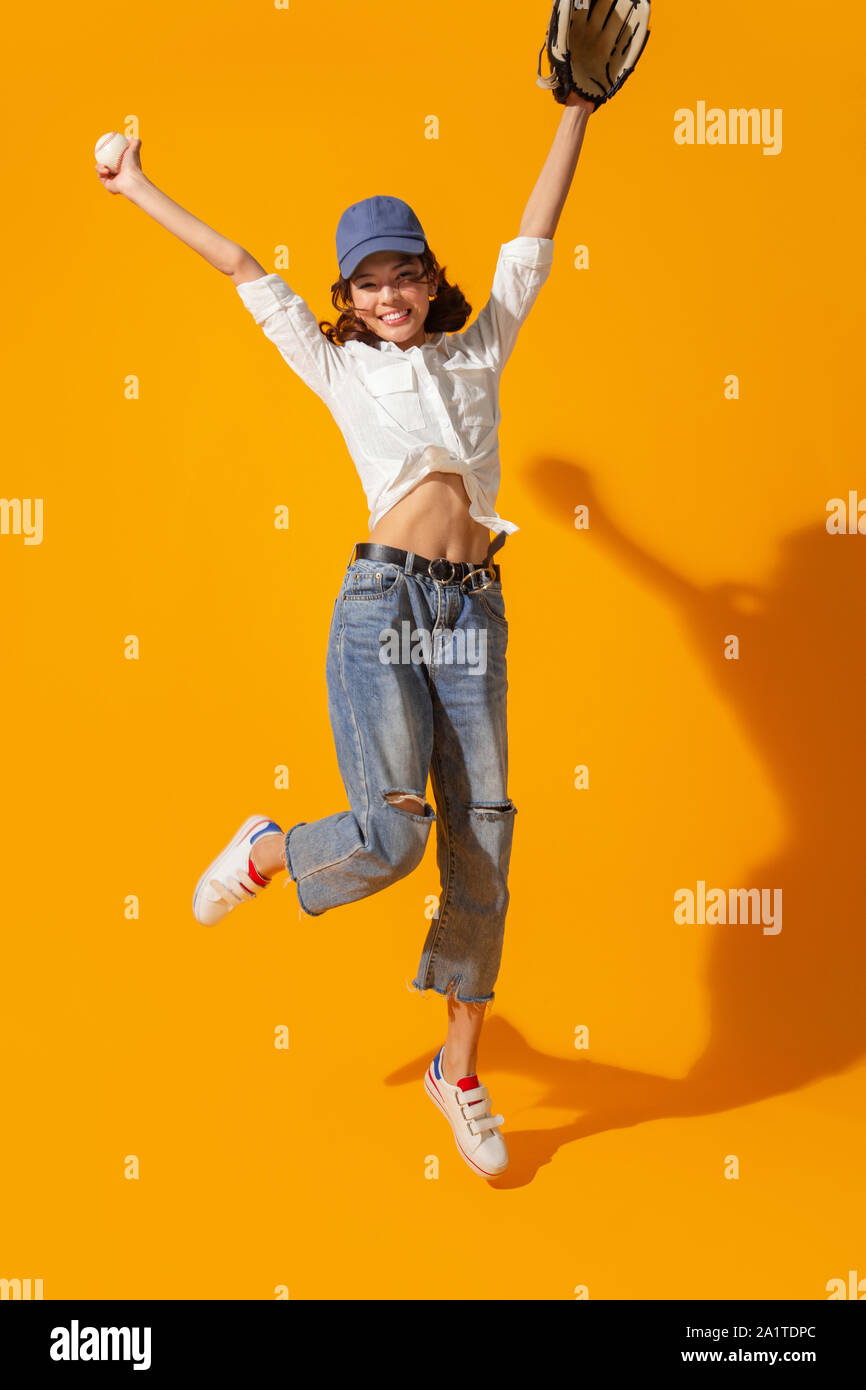 Young girls play baseball Stock Photo - Alamy