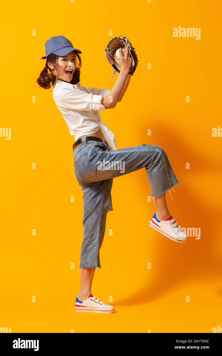 Young girls play baseball Stock Photo - Alamy