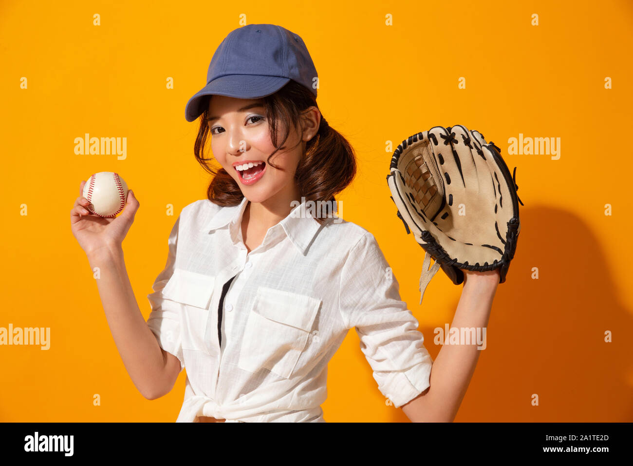 Young girls play baseball Stock Photo - Alamy