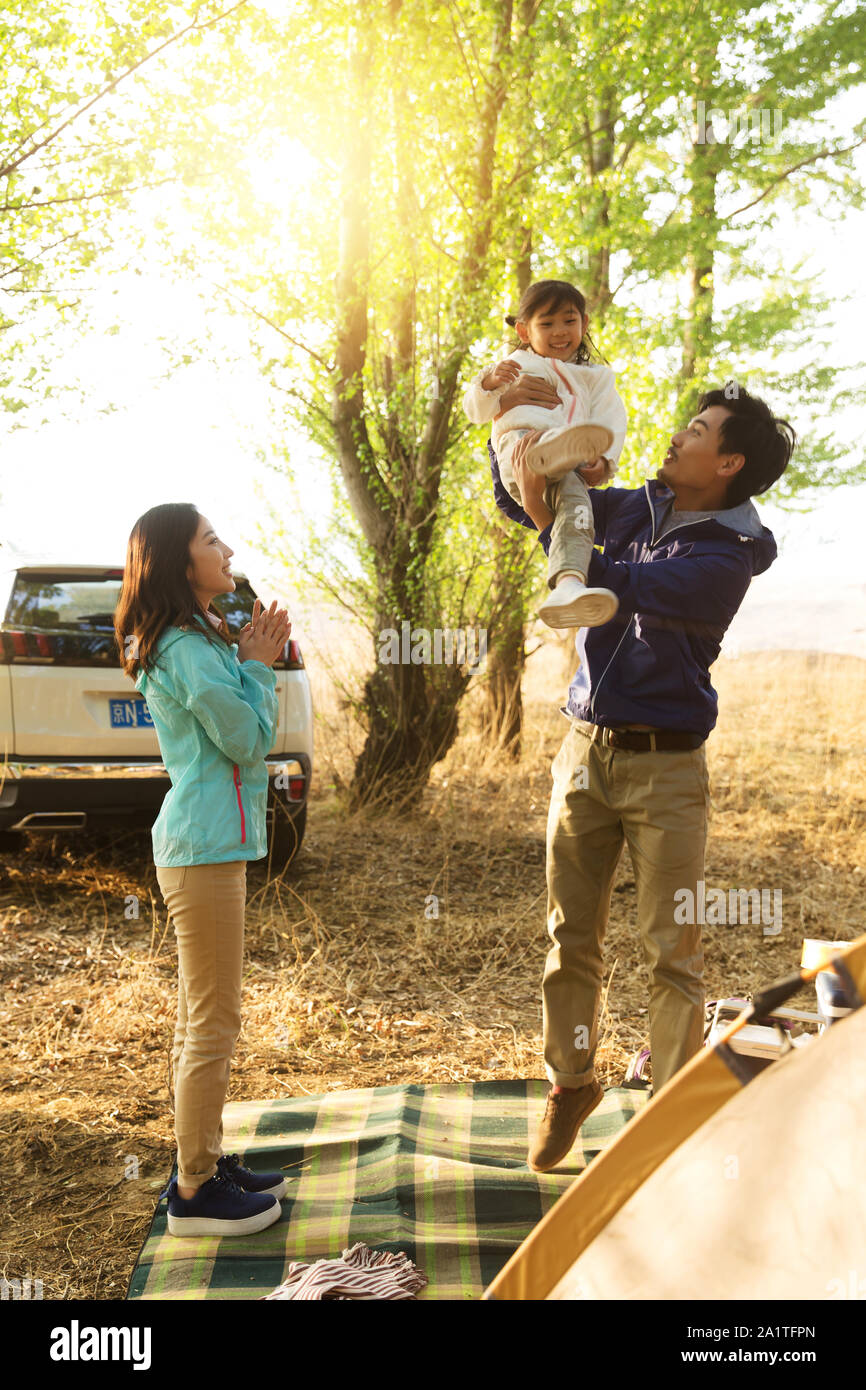 A happy family in the outdoor outing Stock Photo - Alamy