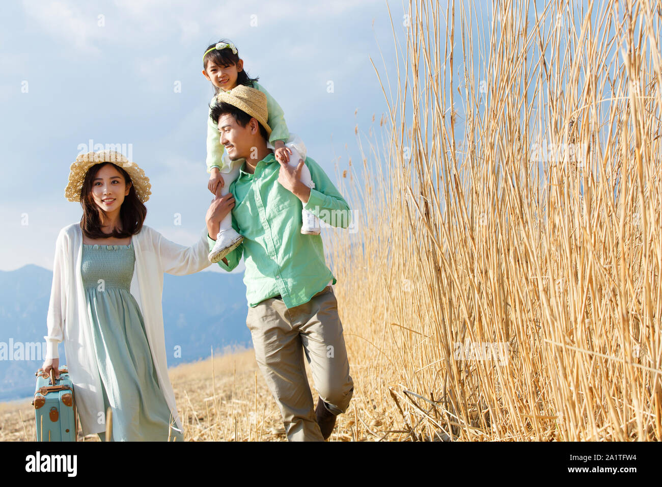 A happy family in the outdoor outing Stock Photo - Alamy