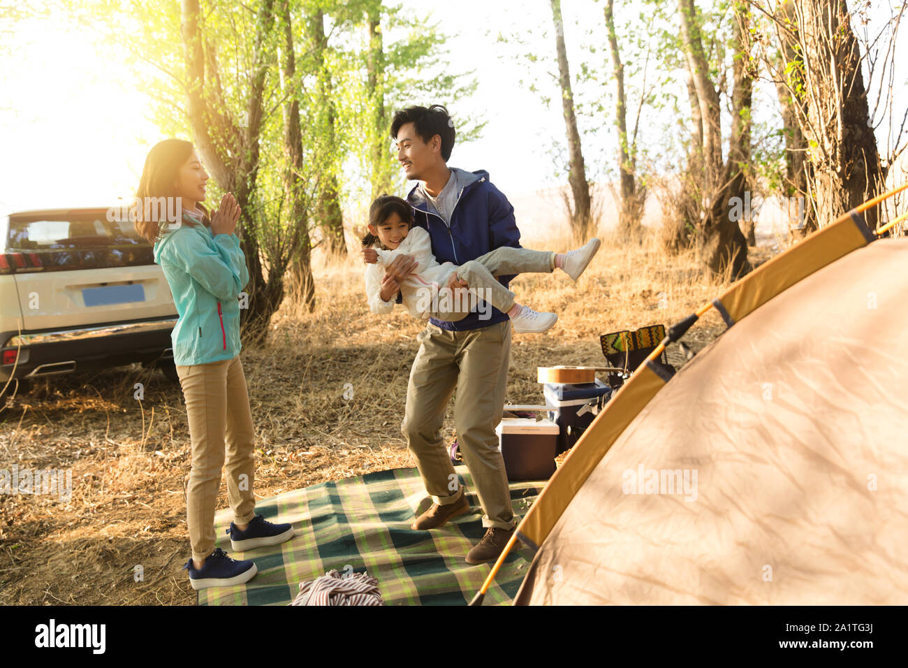 A happy family in the outdoor outing Stock Photo - Alamy
