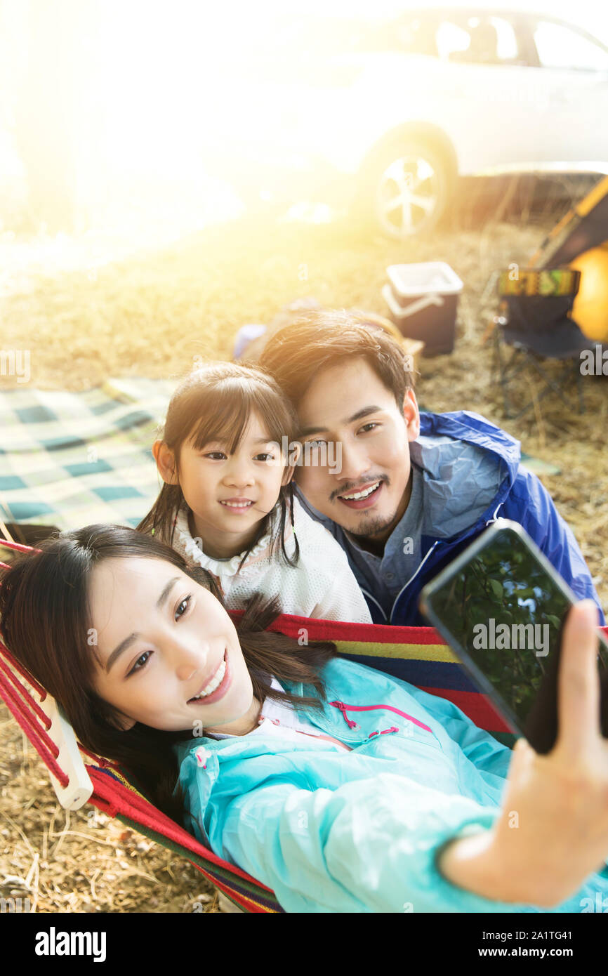 A happy family in the outdoor outing Stock Photo - Alamy