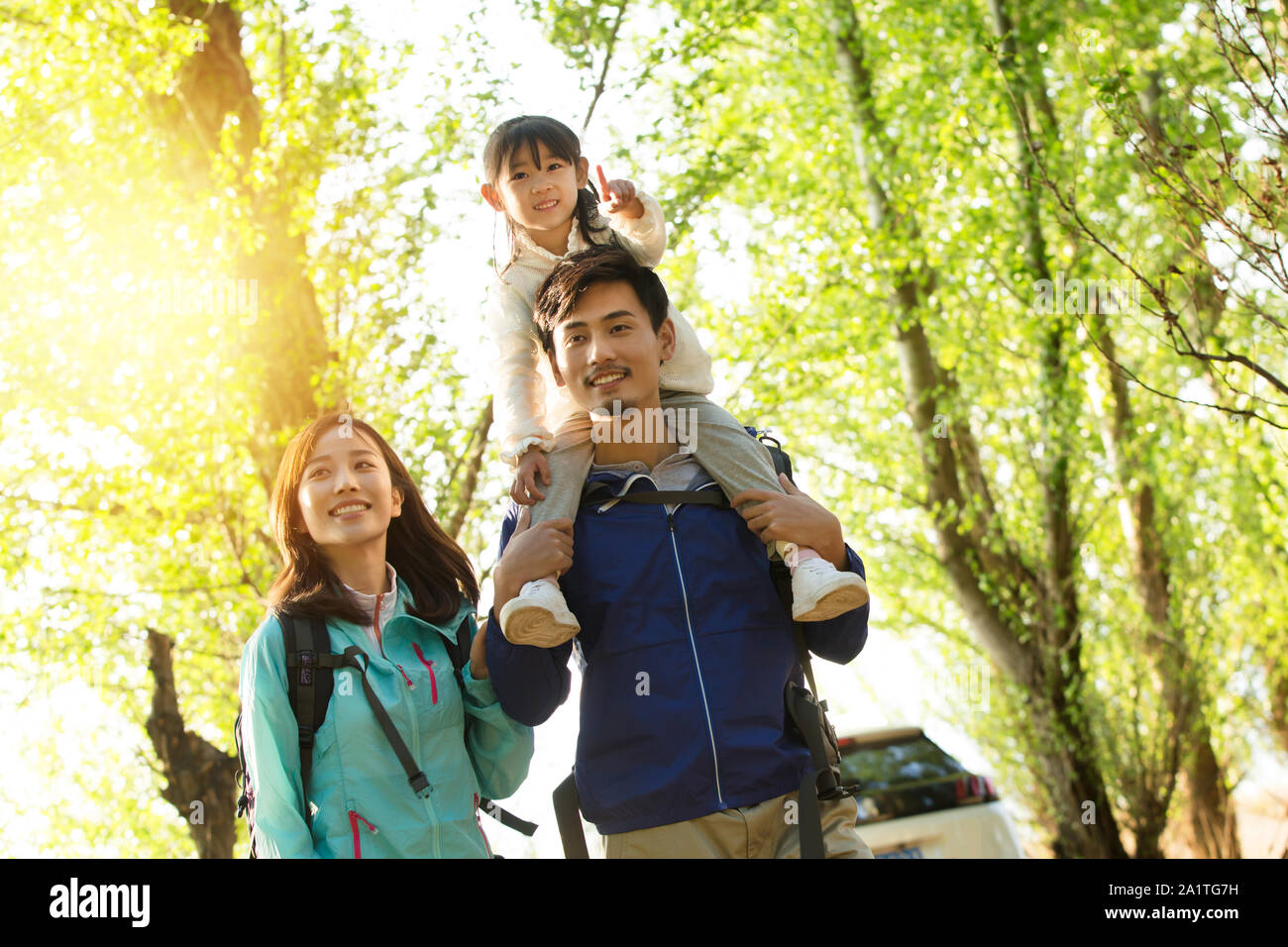 A happy family in the outdoor outing Stock Photo - Alamy