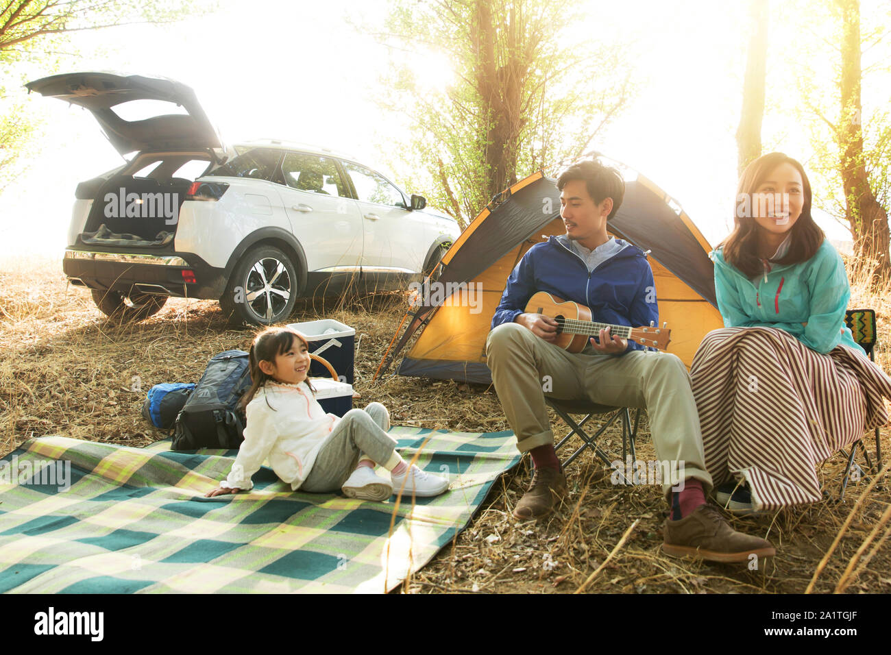 A happy family in the outdoor outing Stock Photo - Alamy