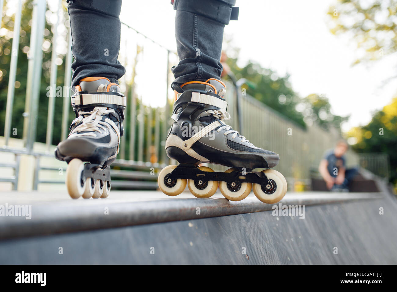 Roller skating, male skater standing on ramp Stock Photo - Alamy