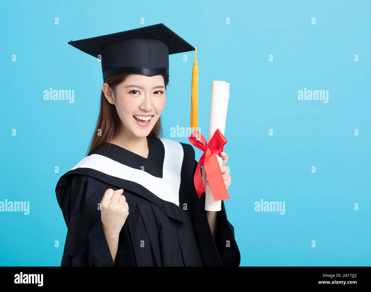 Happy asian female graduate student holding diploma isolated Stock ...