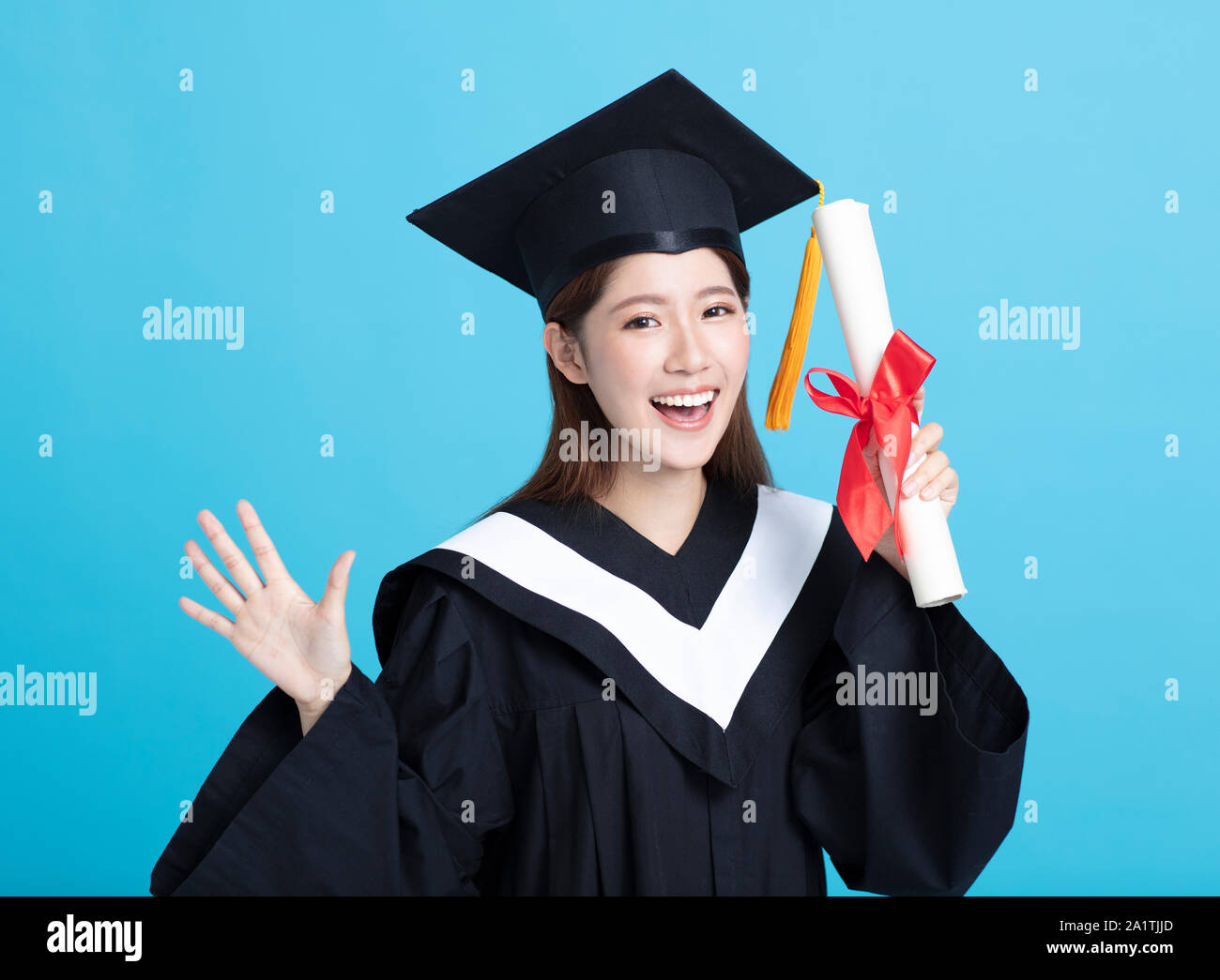 Happy asian female graduate student holding diploma isolated Stock ...