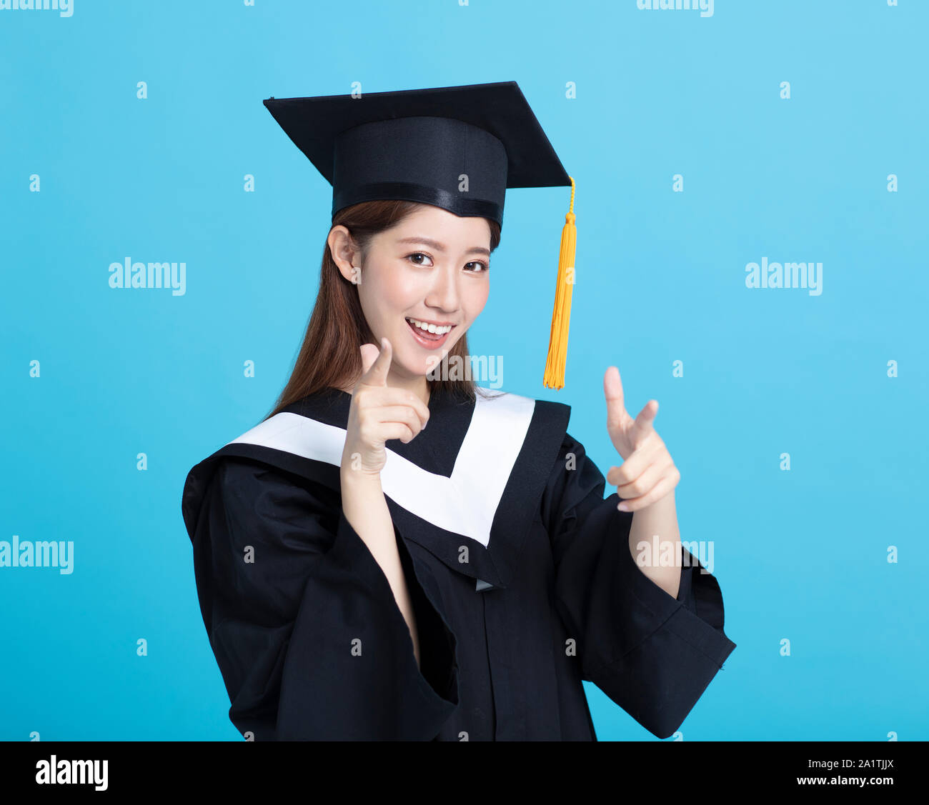 Happy asian female graduate student isolated Stock Photo - Alamy