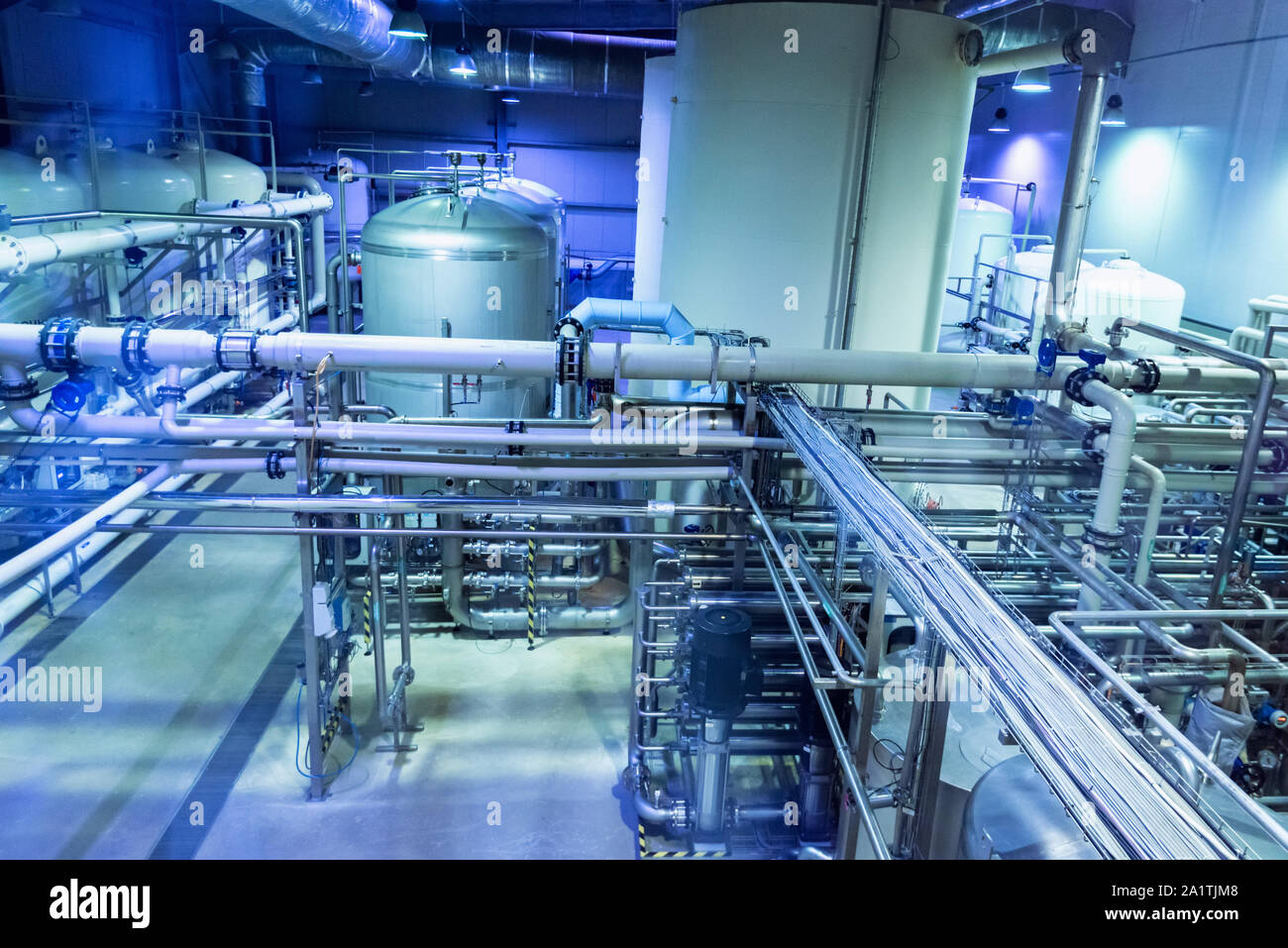 View of tubes and appliances at soft drinks factory Stock Photo - Alamy