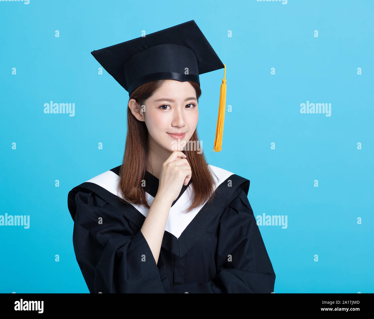 Happy asian female graduate student isolated Stock Photo - Alamy