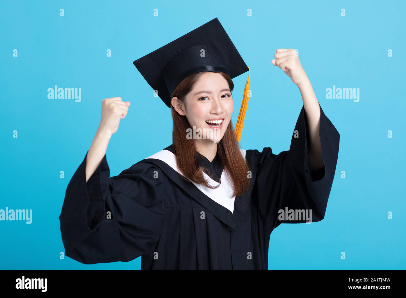 Happy asian female graduate student isolated Stock Photo - Alamy