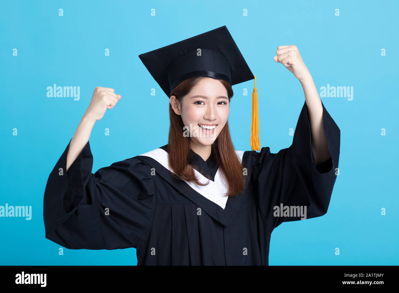 Happy asian female graduate student isolated Stock Photo - Alamy