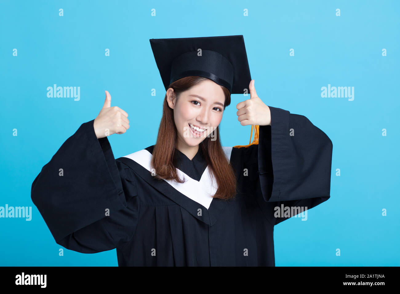 Happy asian female graduate student isolated Stock Photo - Alamy