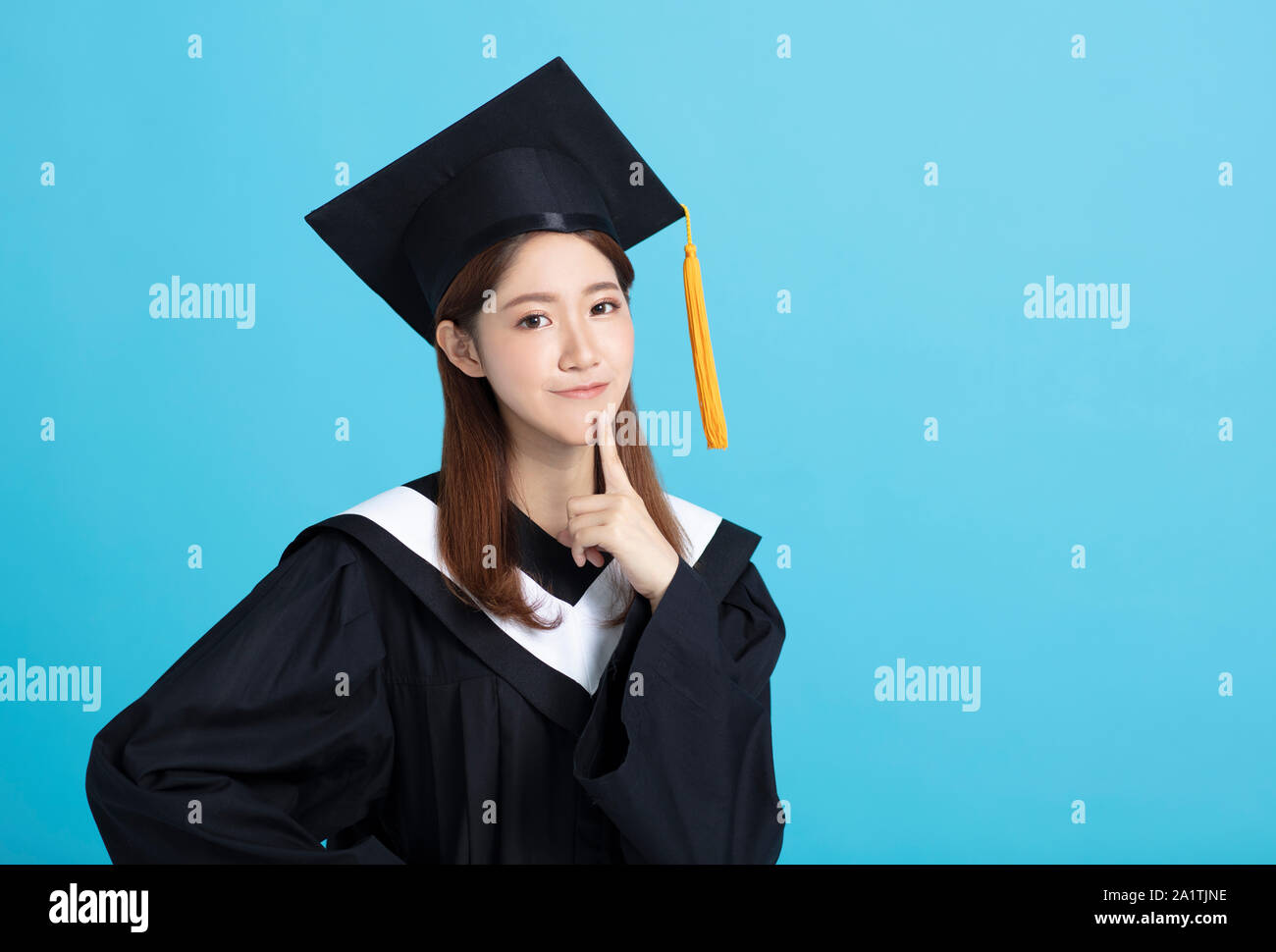 Happy asian female graduate student isolated Stock Photo - Alamy