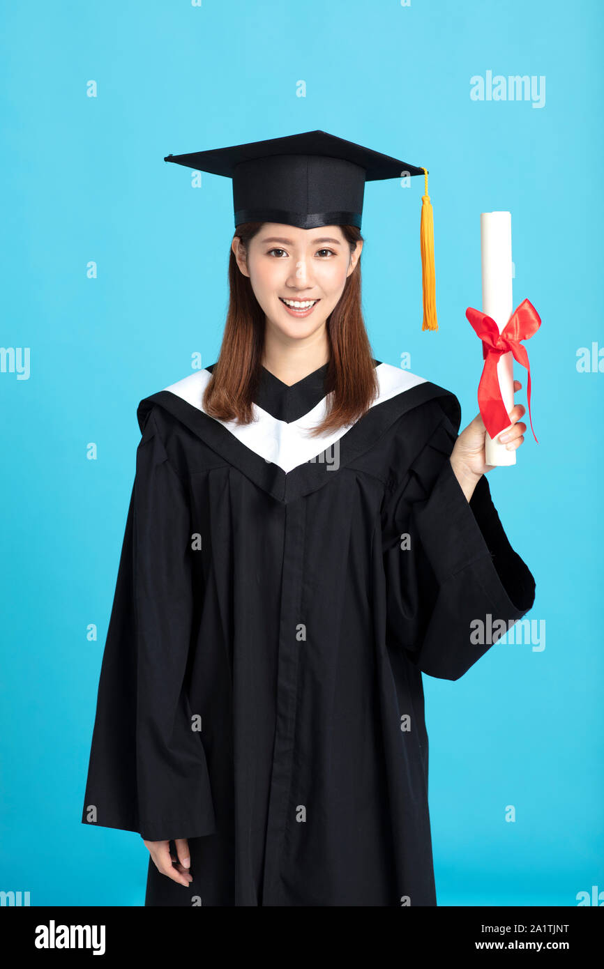 Happy asian female graduate student holding diploma isolated Stock ...