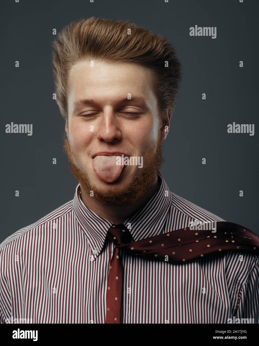 Strong wind blowing in male face, man shows tongue Stock Photo - Alamy