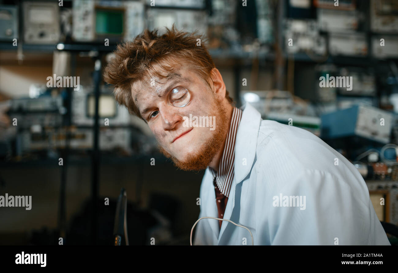 Strange scientist with magnifying glass in the eye Stock Photo - Alamy