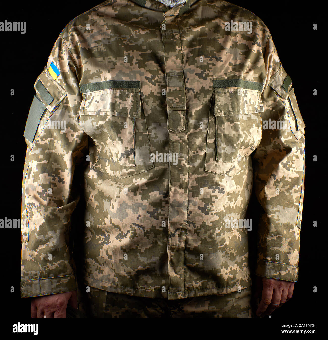 Ukrainian soldier dressed in uniform stands in the dark, low key Stock ...