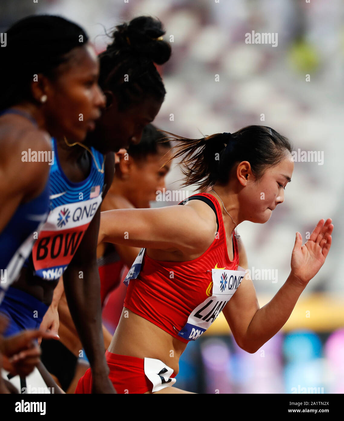Doha, Qatar. 28th Sep, 2019. China's Liang Xiaojing (R) competes during ...