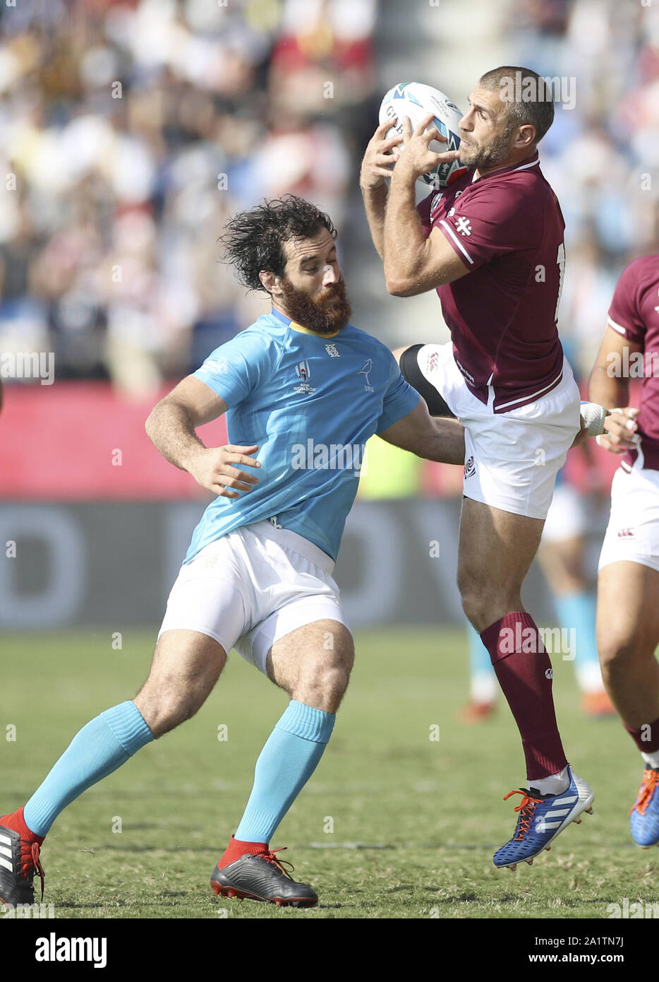 Tokyo, Japan. 29th Sep, 2019. Uruguay's Rodrigo Silva (L) goes to ...
