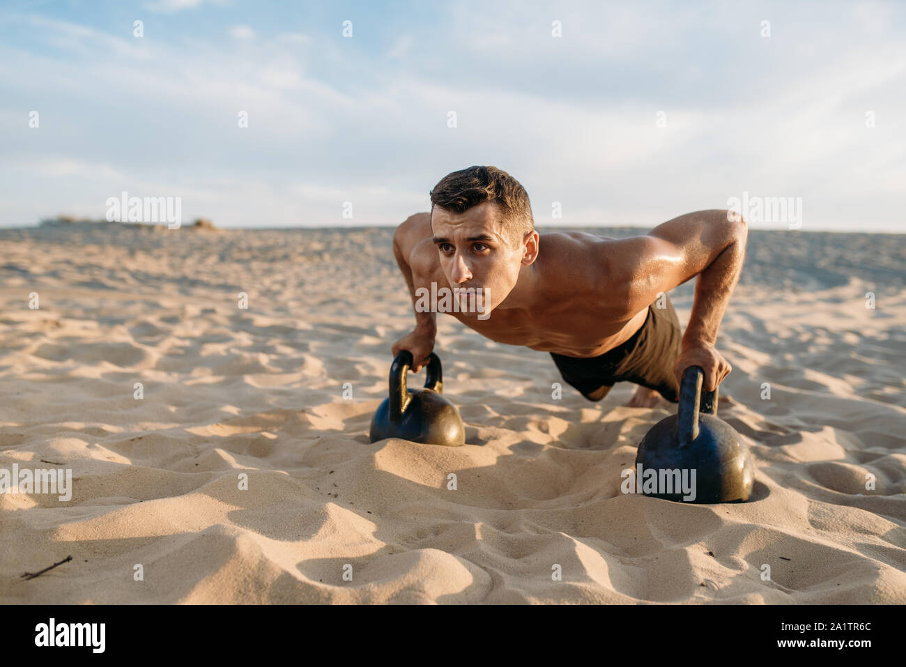 Male athlete doing push-up exercises in desert Stock Photo - Alamy