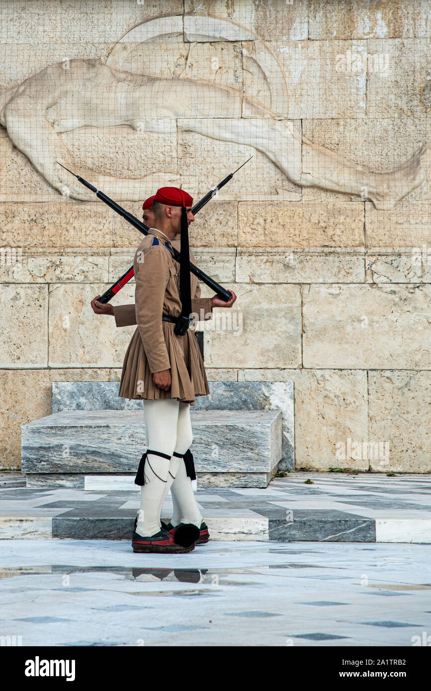 Evzone Greek soldiers with traditional dressing and guns parading in ...
