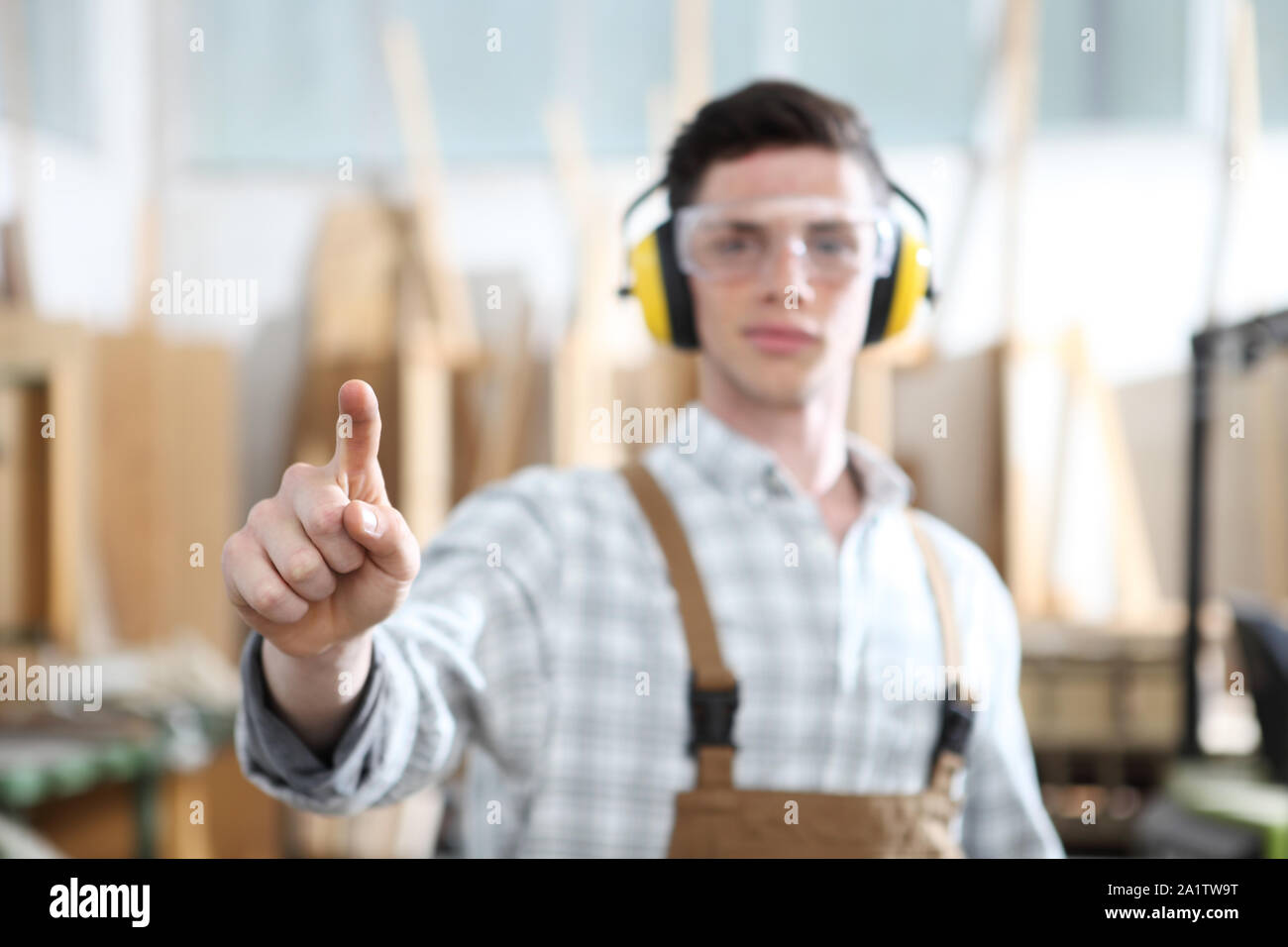 carpenter man touch screen on carpentry background Stock Photo - Alamy