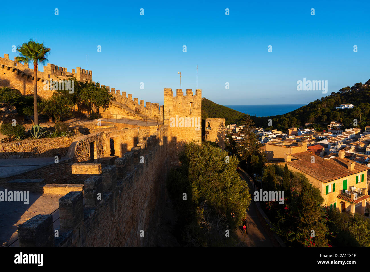 Sunset view from the ramparts of the castle on the town of Capdepera ...