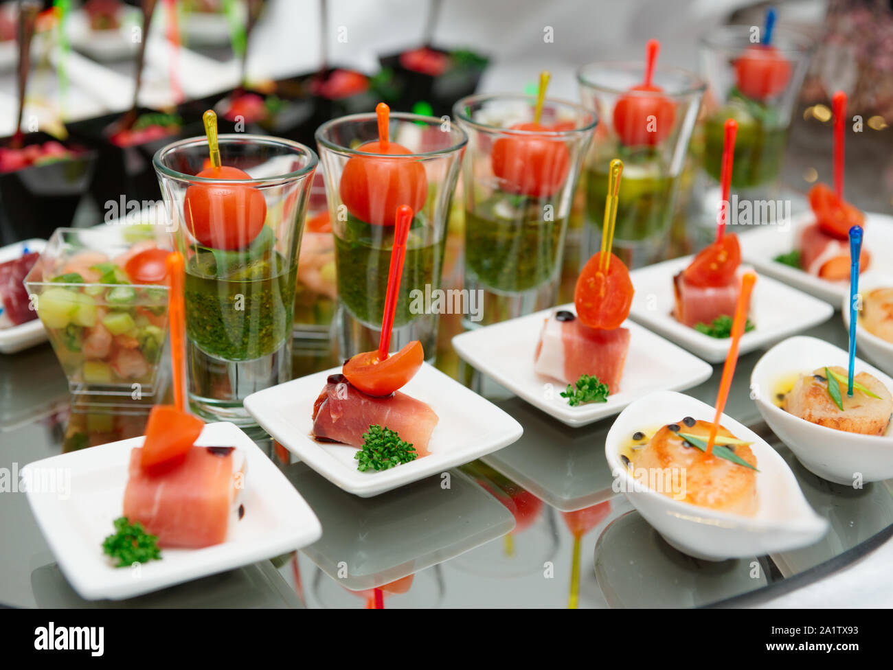 Various snacks on banquet table Stock Photo - Alamy