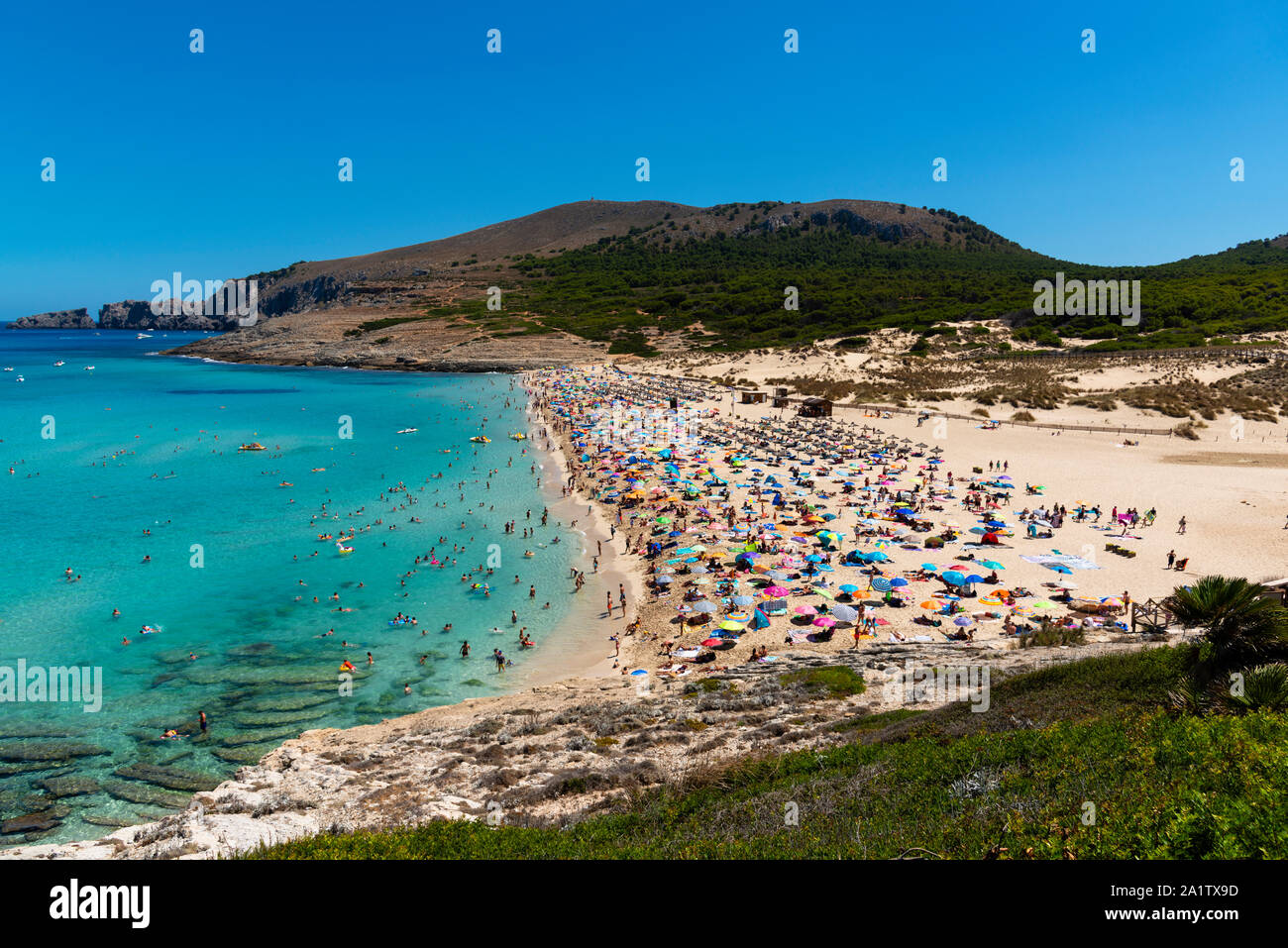 view on the beach of Cala Mesquida Majorca Spain with many tourists and ...