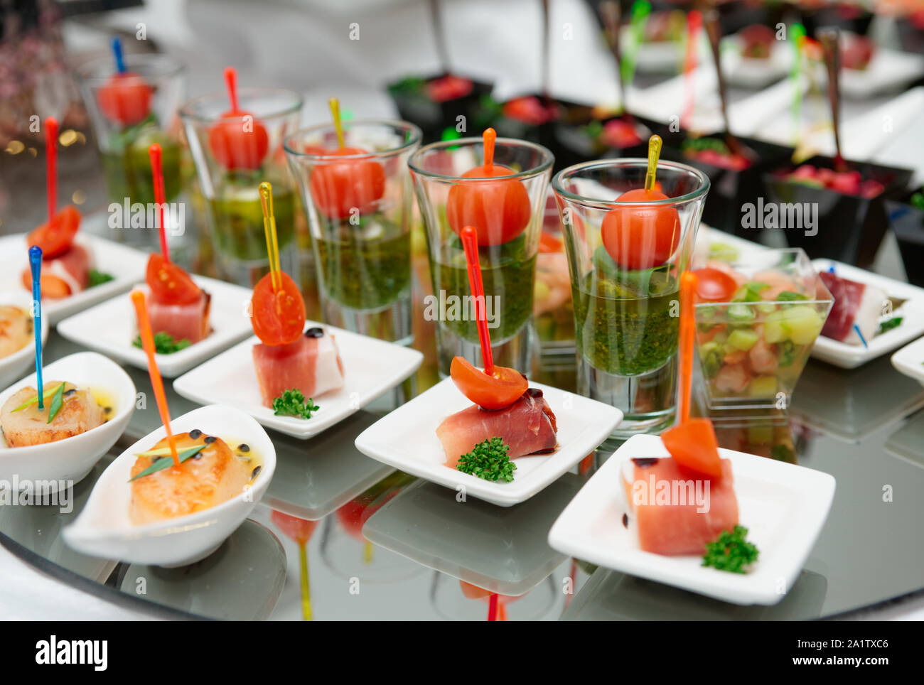 Various snacks on banquet table Stock Photo - Alamy