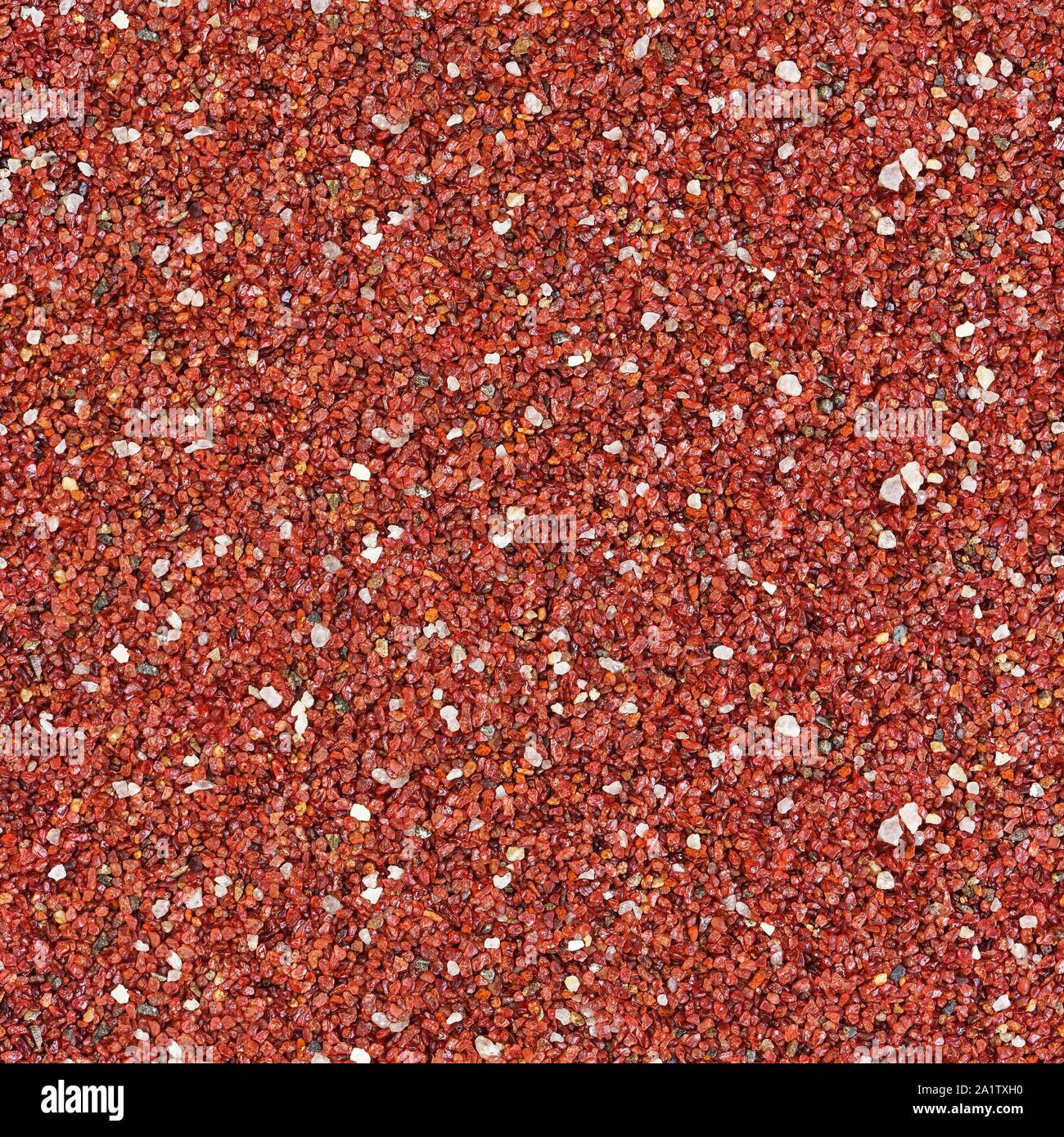 Surface covered with small red stones. Seamless square texture. Tile ...