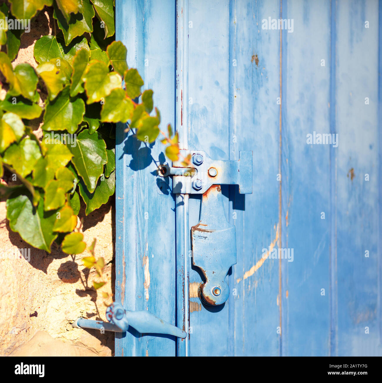 A traditional French style window shutter latch Stock Photo - Alamy