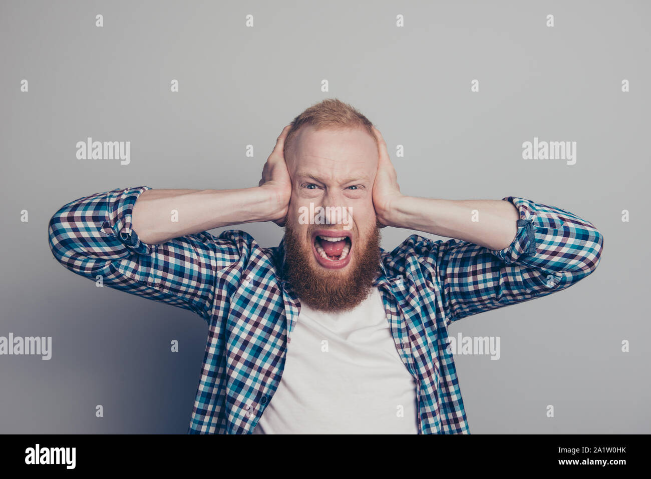 Portrait of close ears two hand man with wide open mouth look at Stock ...