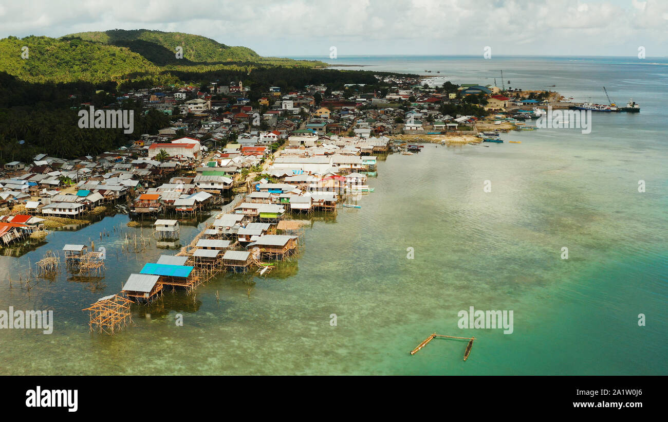 Village of stilt houses built over the sea, top view. Dapa, Siargao ...