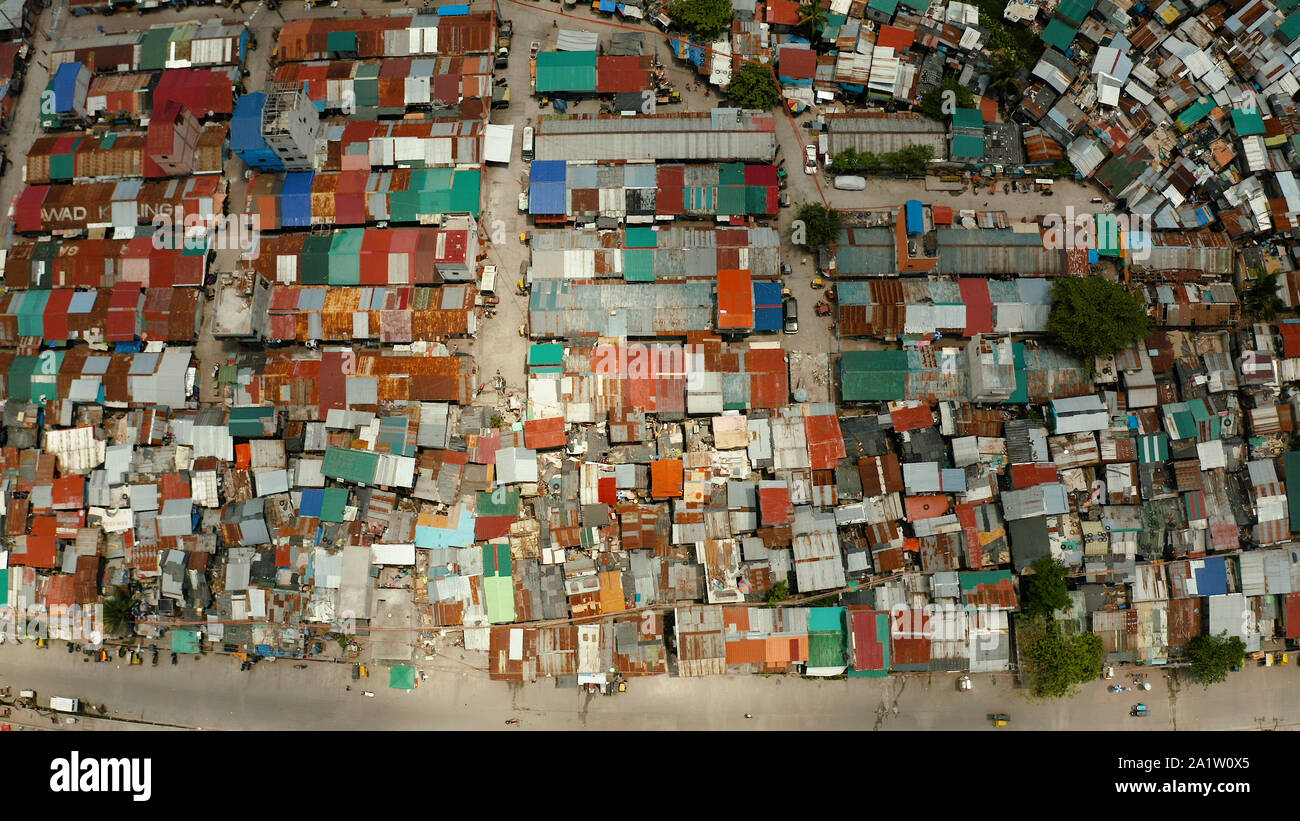 Dense building houses in the slums of Manila top view. Overpopulated ...