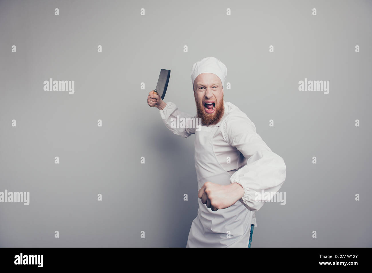 Portrait of crazy mad attractive handsome butcher guy holding kn Stock ...