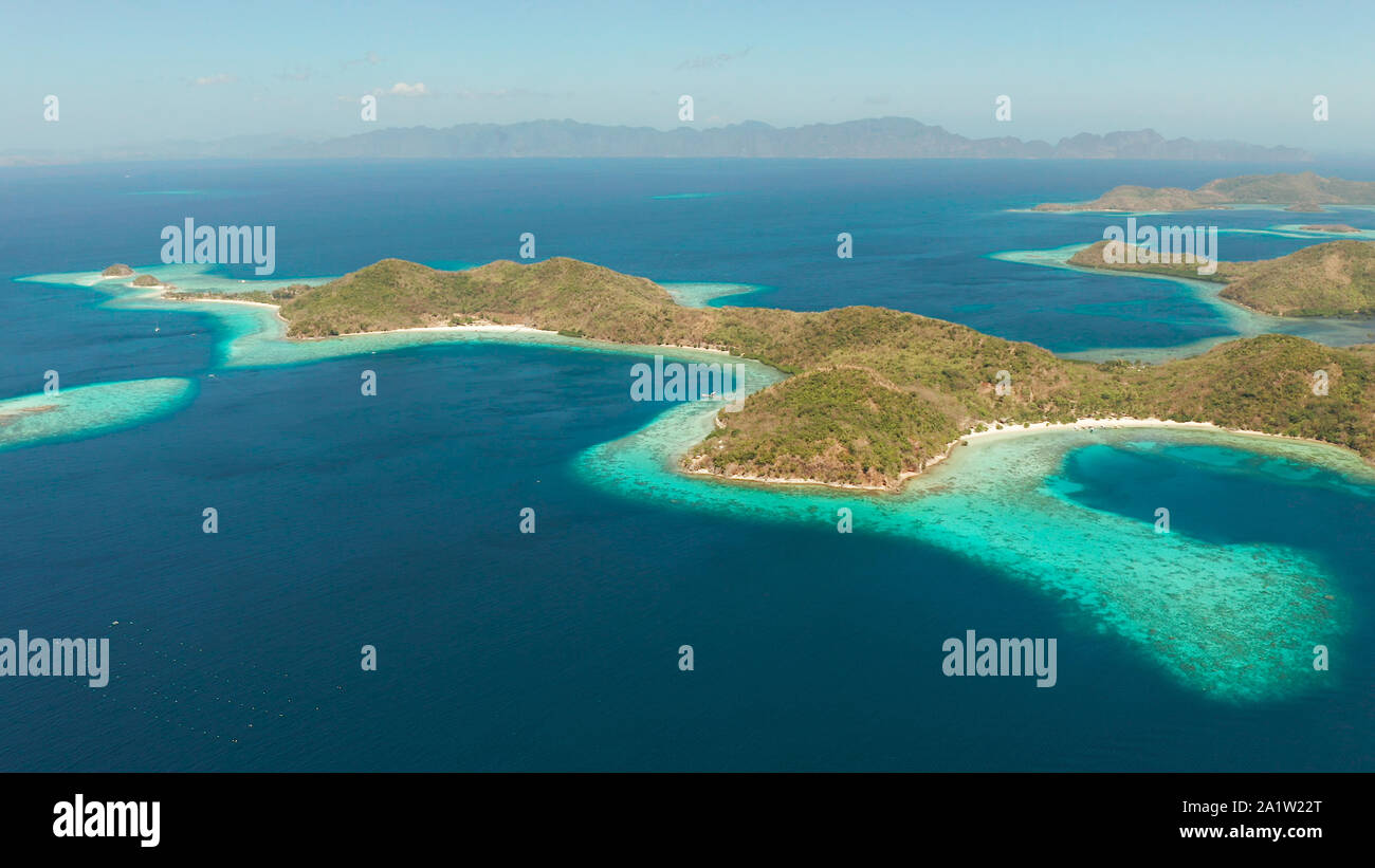 aerial view tropical islands with blue lagoon, coral reef and sandy ...