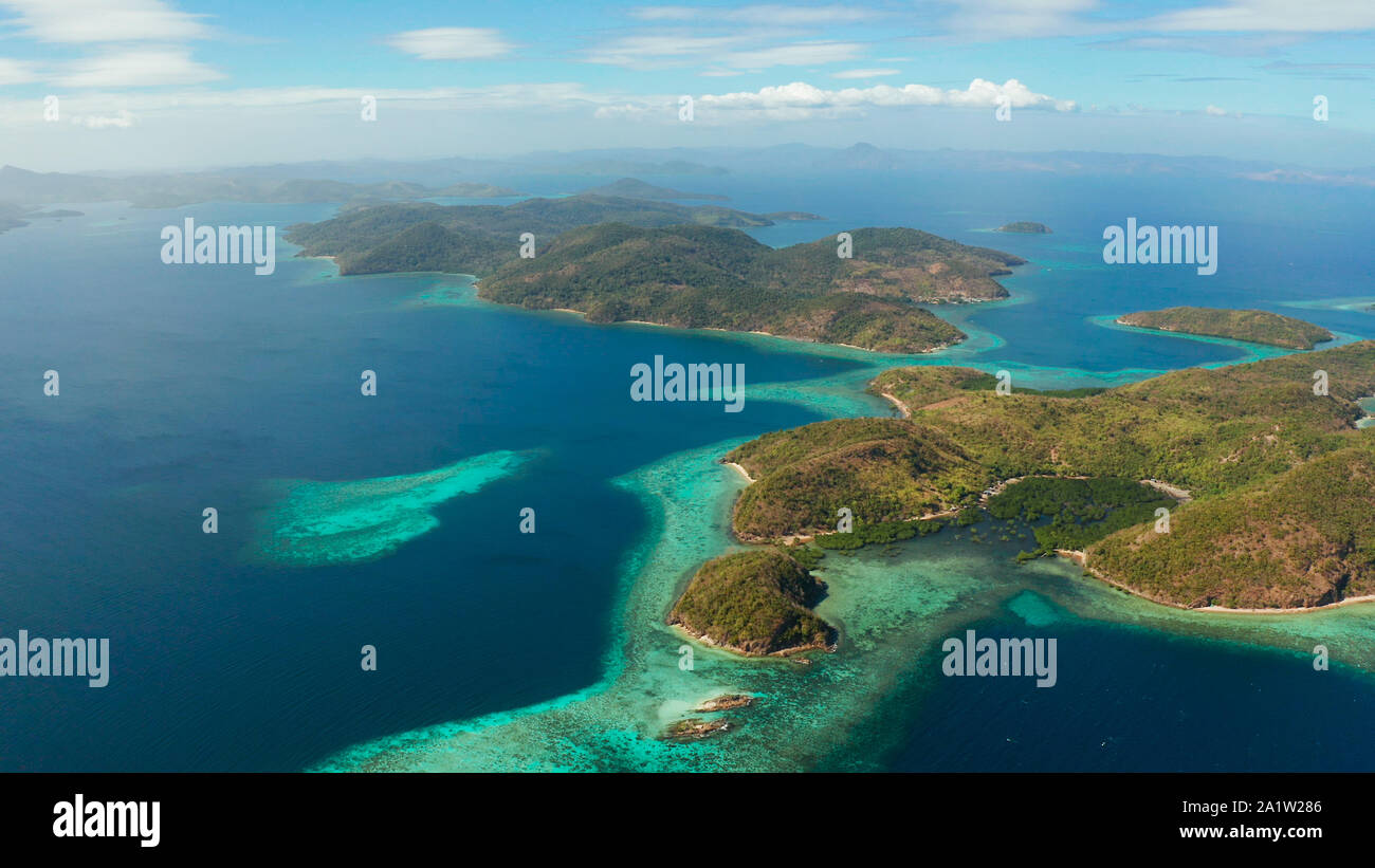 aerial view tropical islands with blue lagoons, coral reef and sandy ...