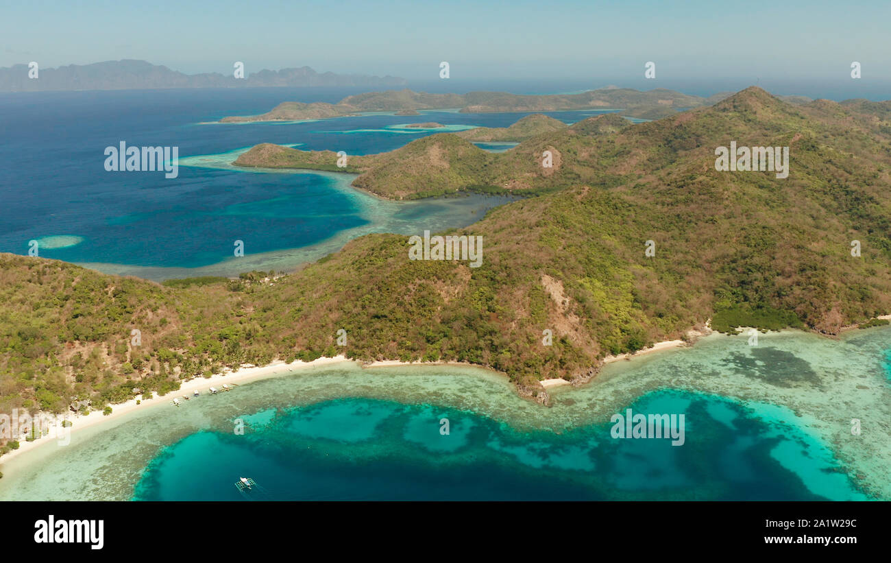 aerial view tropical islands with blue lagoon, coral reef and sandy ...