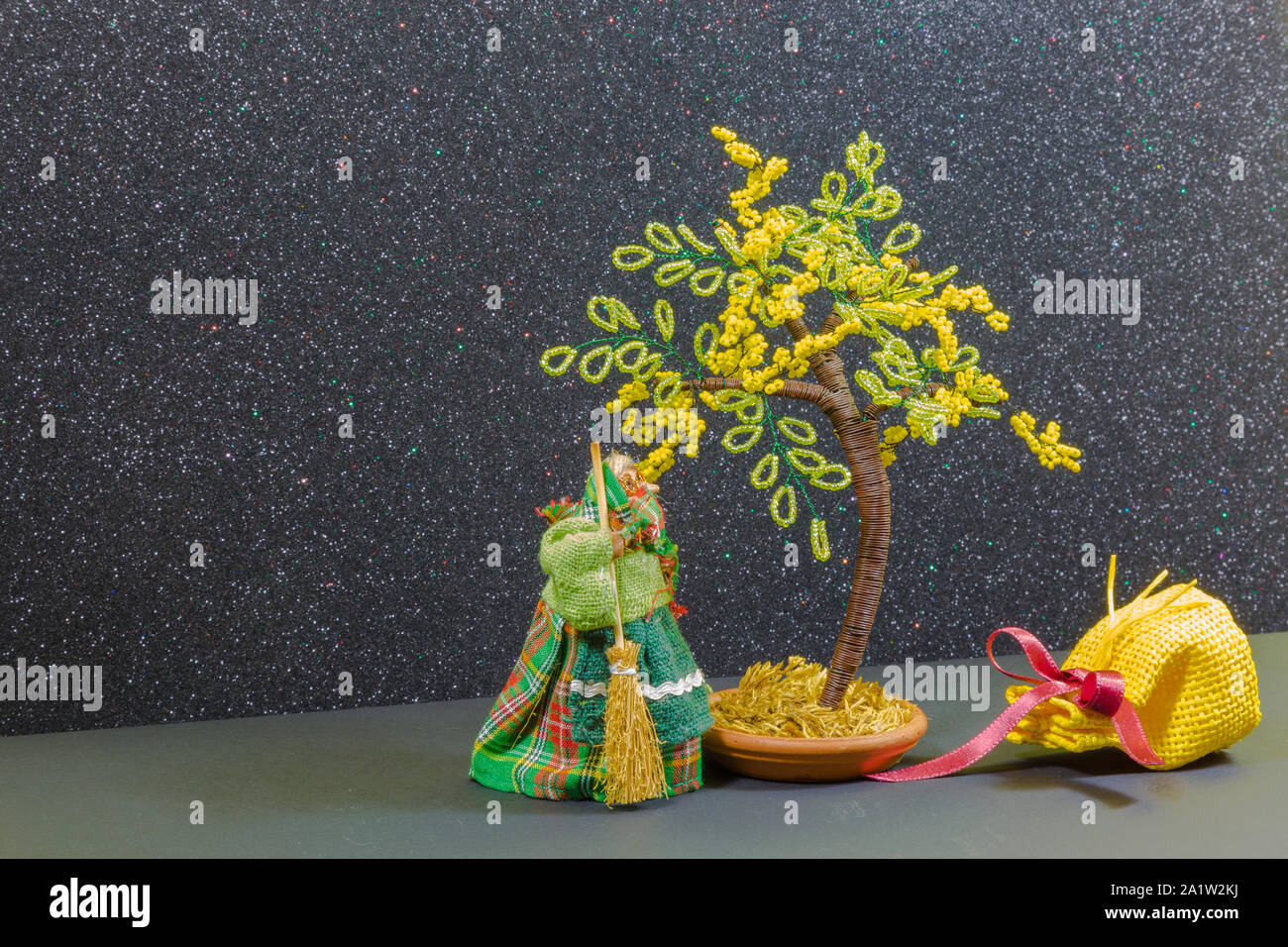 Old witch with yellow tree and bag on the black background Stock Photo ...