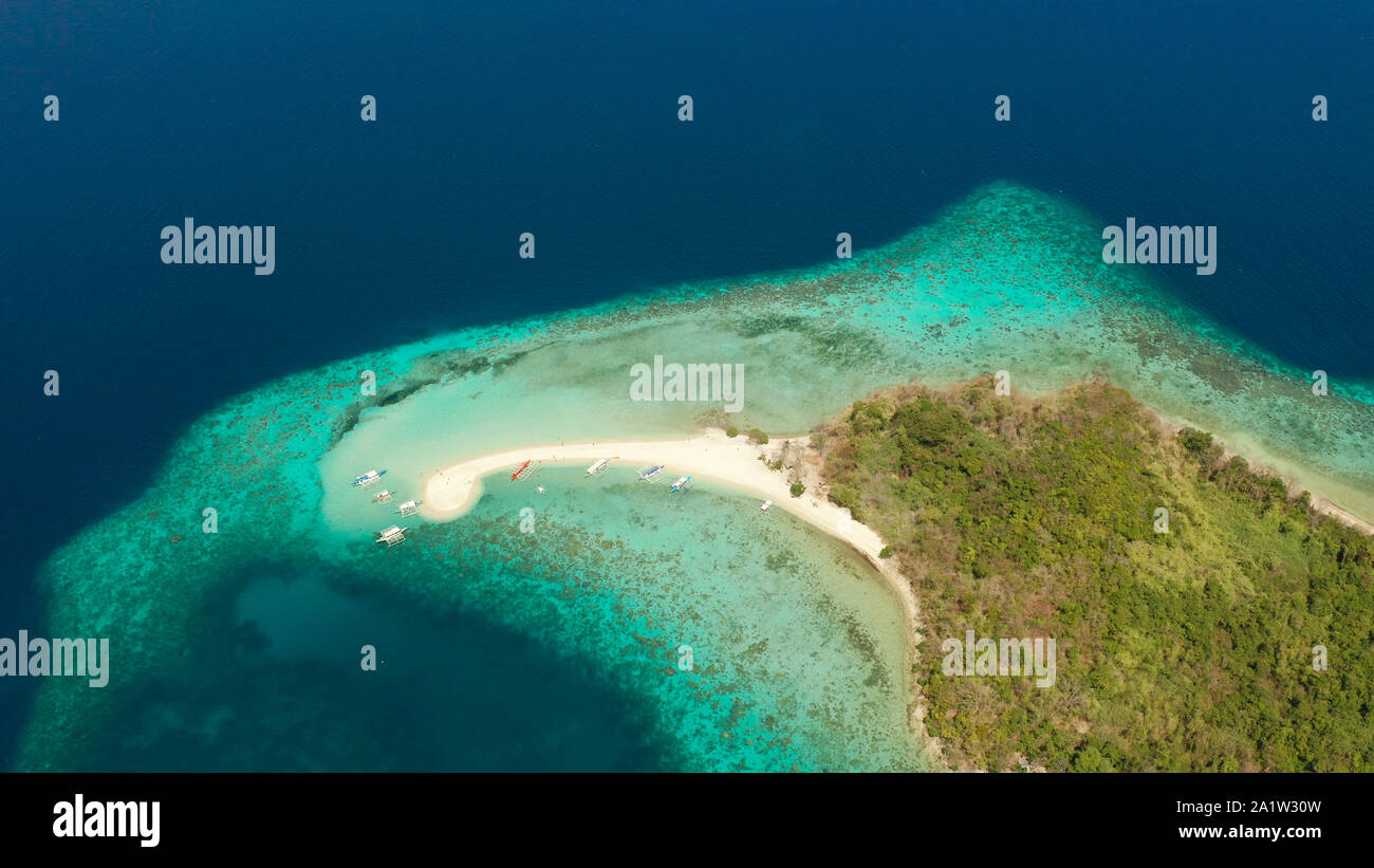 aerial seascape tropical island with sand bar, turquoise water and ...